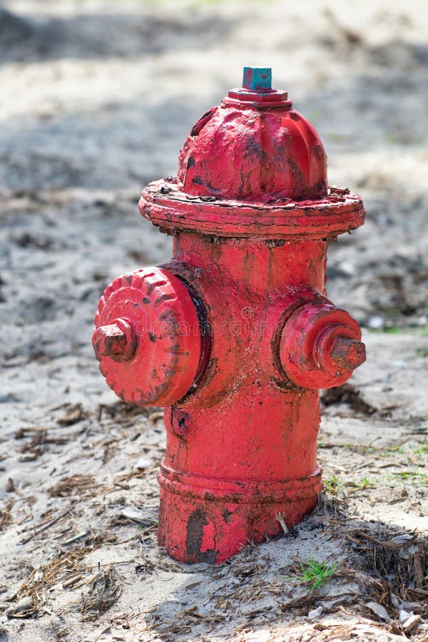 Red hydrant on the beach stock photo. Image of machine - 299443330