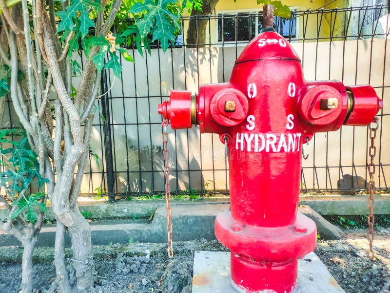 A Red Hydrant is Installed in a Residential Area Stock Image - Image of ...