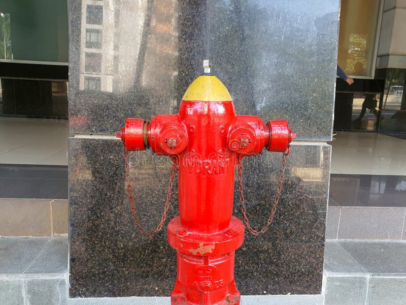 Red Hydrant Pillar Stands Outside the Building Stock Photo - Image of ...