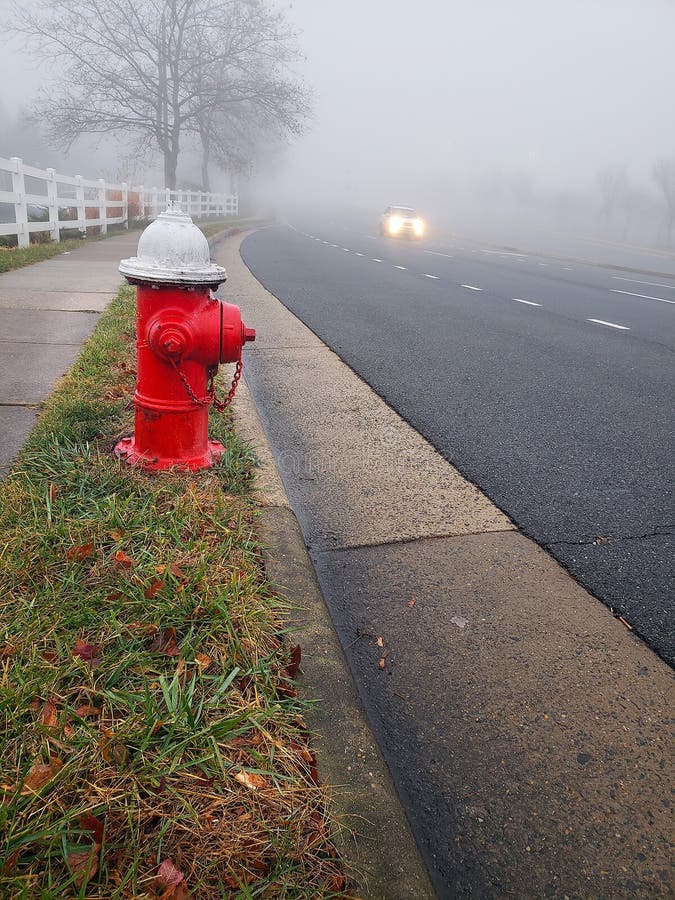 Red Hydrant on the Side of the Road on an Early Foggy Morning Stock ...