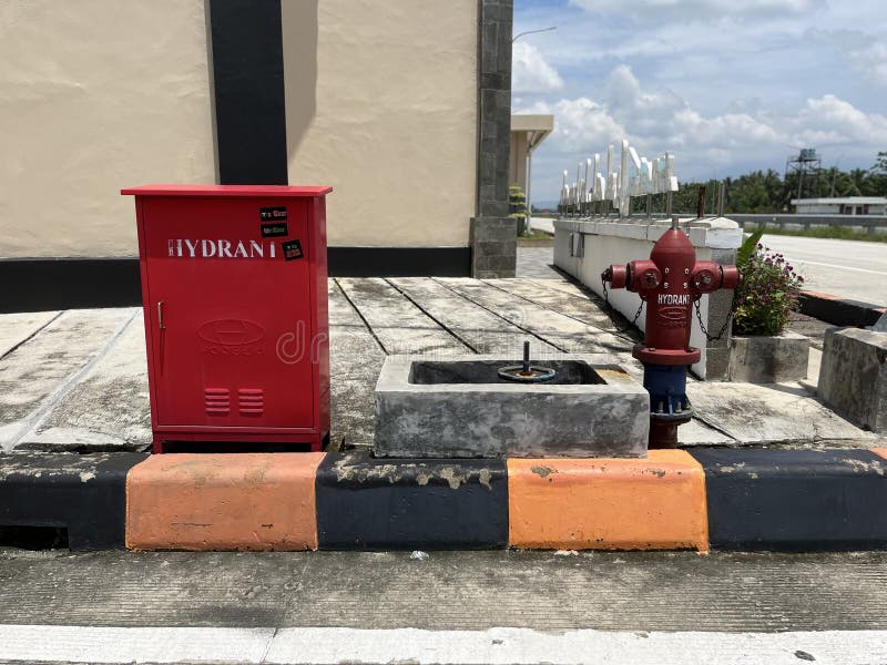 A Red Hydrant for Storing Water during a Fire Incident is Installed on ...