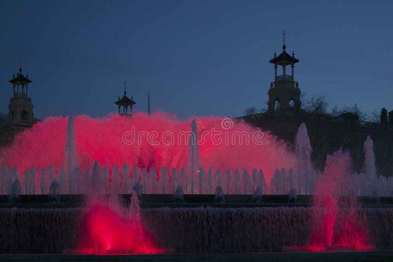Red Illuminated Fountain in the Evening Light of Barcelona Stock Photo ...