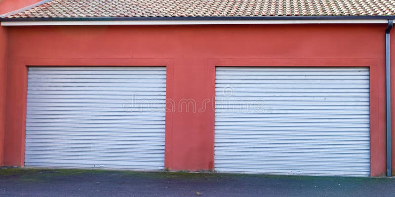 Red Industrial Building Facade Closed Two Grey Roller Shutter Gate ...
