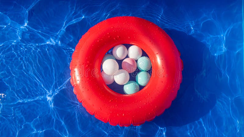 Red Inflatable Circle Floating in Blue Swimming Pool Water Stock Image ...