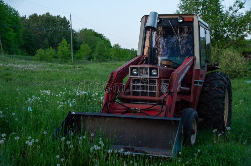 A Red International Tractor on a Meadow Stock Photo - Image of road ...