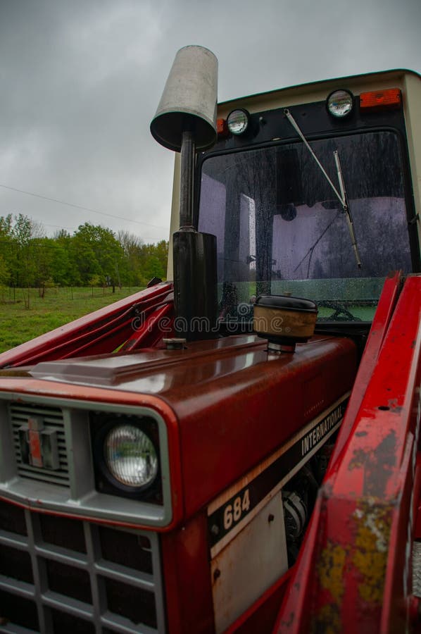 A Red International Tractor on a Meadow Editorial Photo - Image of ...