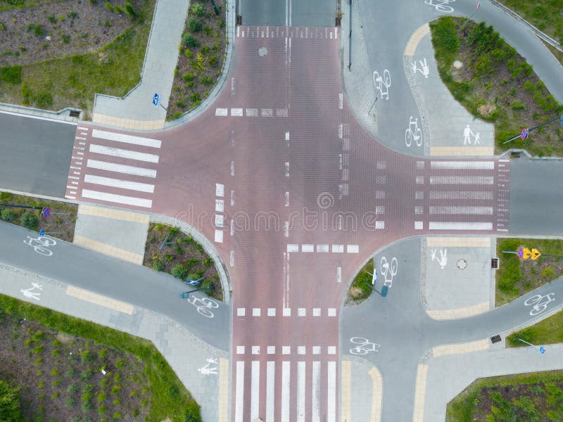 Red Intersection with Pedestrian Crossing and Bicycle Paths Stock Image ...