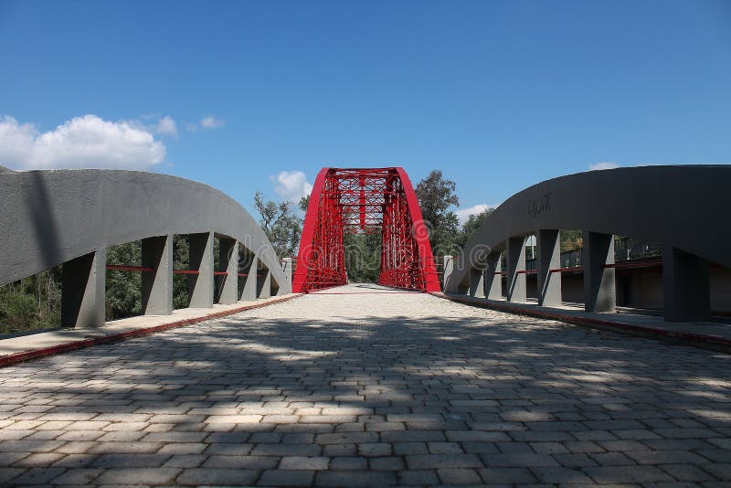 Red Iron Bridge in Perspective Stock Photo - Image of estate, blue ...