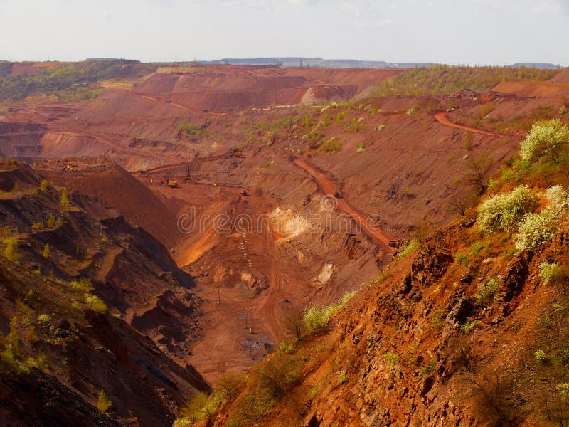 Red iron ore open-pit mine stock photo. Image of industrial - 70250688