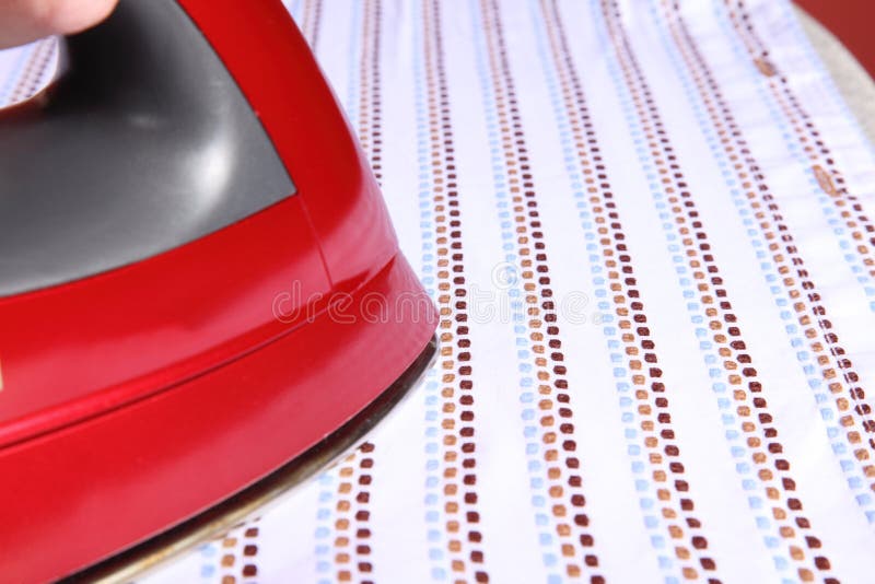 Red Iron and shirt stock photo. Image of laundry, shirt - 32608202