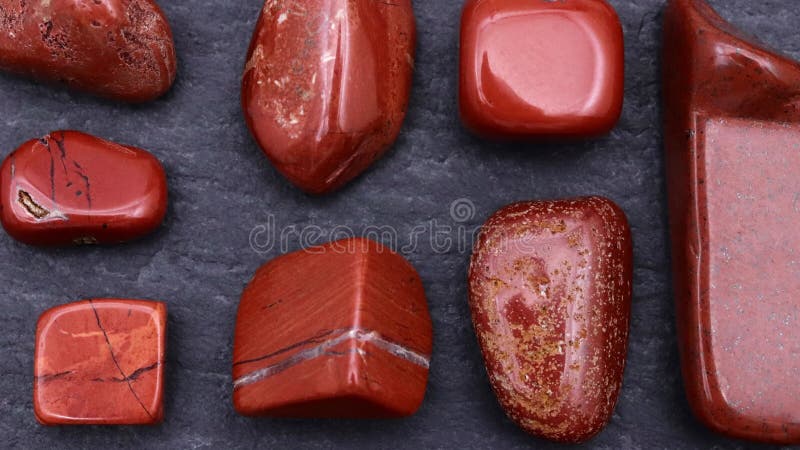 Red Jasper Rare Jewel Stones Texture on Black Stone Background. Moving ...