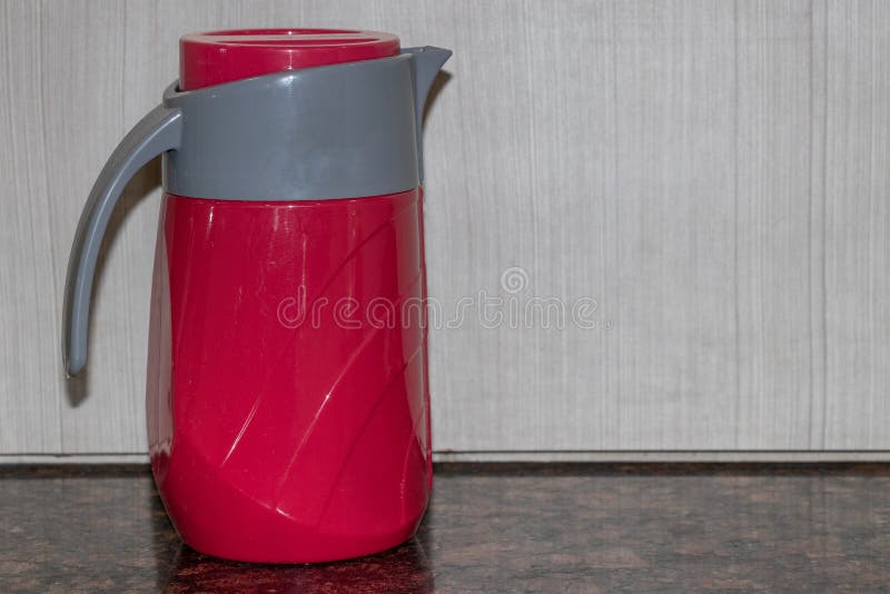Red jug on table stock image. Image of container, isolated - 146252281