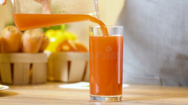 Red Juice Being Poured into a Glass on White Background Stock Footage ...