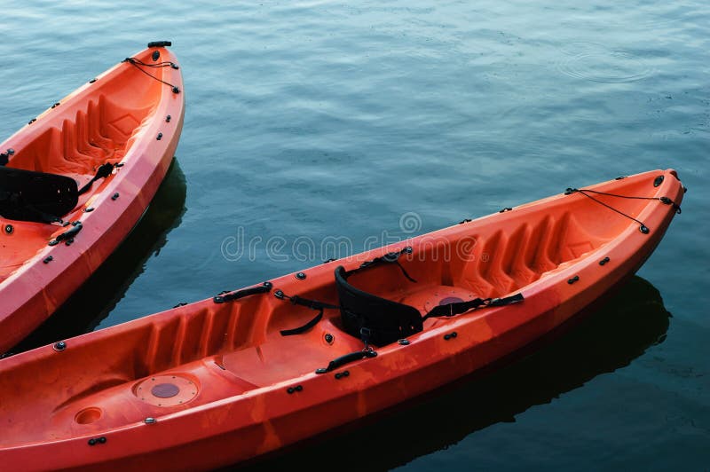 Red Kayak on Dark River Water Stock Photo - Image of plastic, kayak ...
