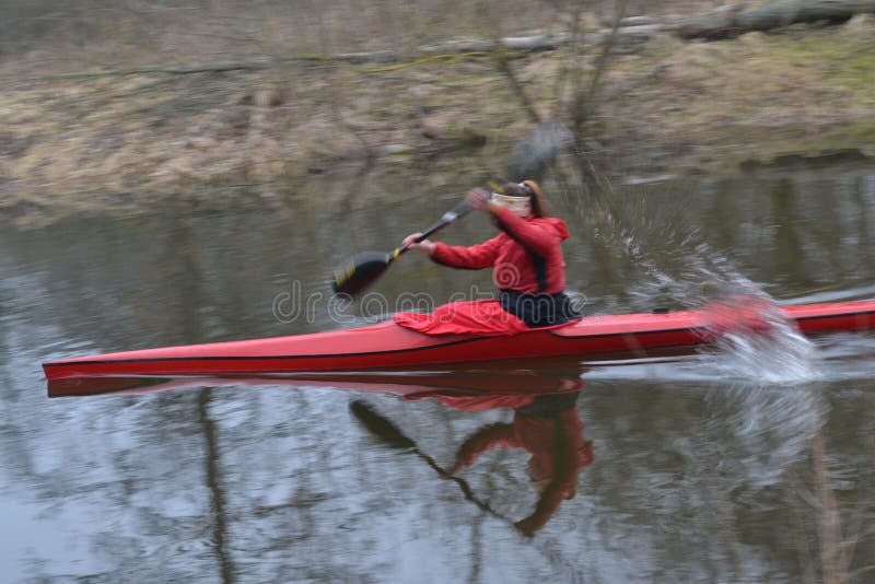 Red Kayak Floats Along the River in Early Spring Stock Image - Image of ...