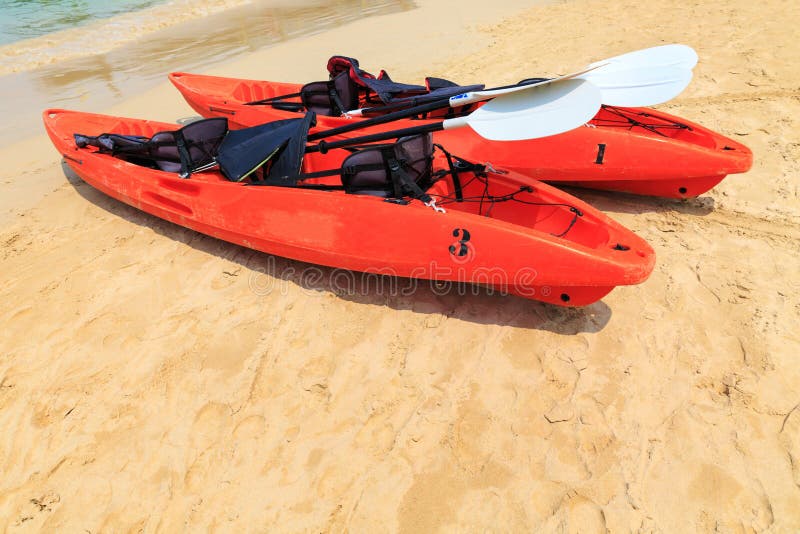 Red kayak on sea beach stock photo. Image of relax, life - 56004362