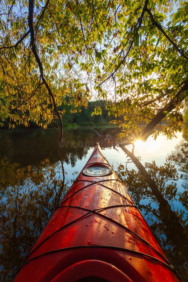 Red Kayak Under Trees at Sunset and Beautiful River Stock Photo - Image ...