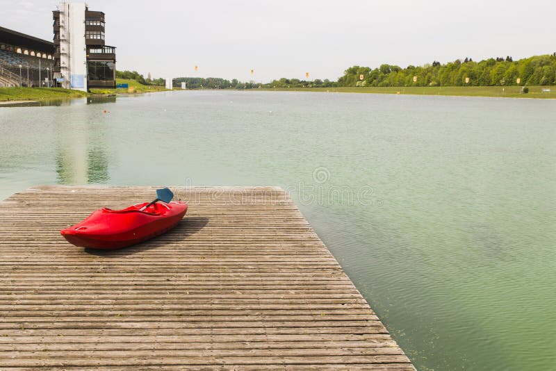 A Red Kayak on Wooden Jetty in a Lake Stock Image - Image of kayaking ...