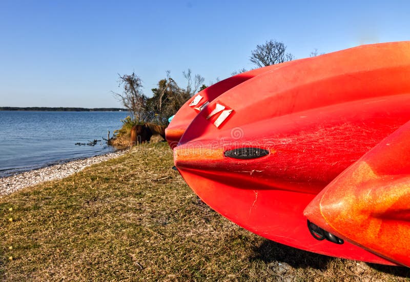 Red Kayaks Dominate the Image at the Beach - Assateague, MD, USA Stock ...