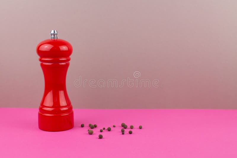 Red Kitchen Pepper Shaker for Ground Pepper on the Table Stock Photo ...