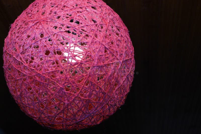 Red Knitted Ball of Red Thread As the Ceiling for a Light Bulb Stock ...