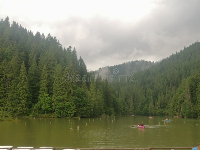 Nature Red lake in Romania stock image. Image of vehicle - 191499151
