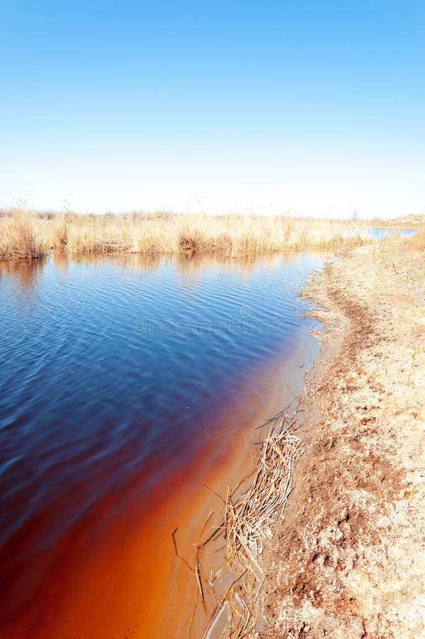 Red lake stock photo. Image of landscape, lagoon, scenic - 122170468