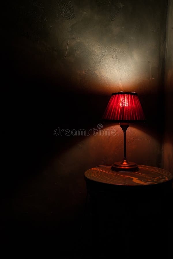 Red Lamp on a Brown , Round Table Stock Image - Image of dark ...