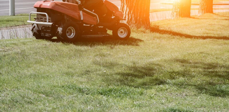 Red Lawn Mower Cutting Grass Stock Photo - Image of work, garden: 273939546