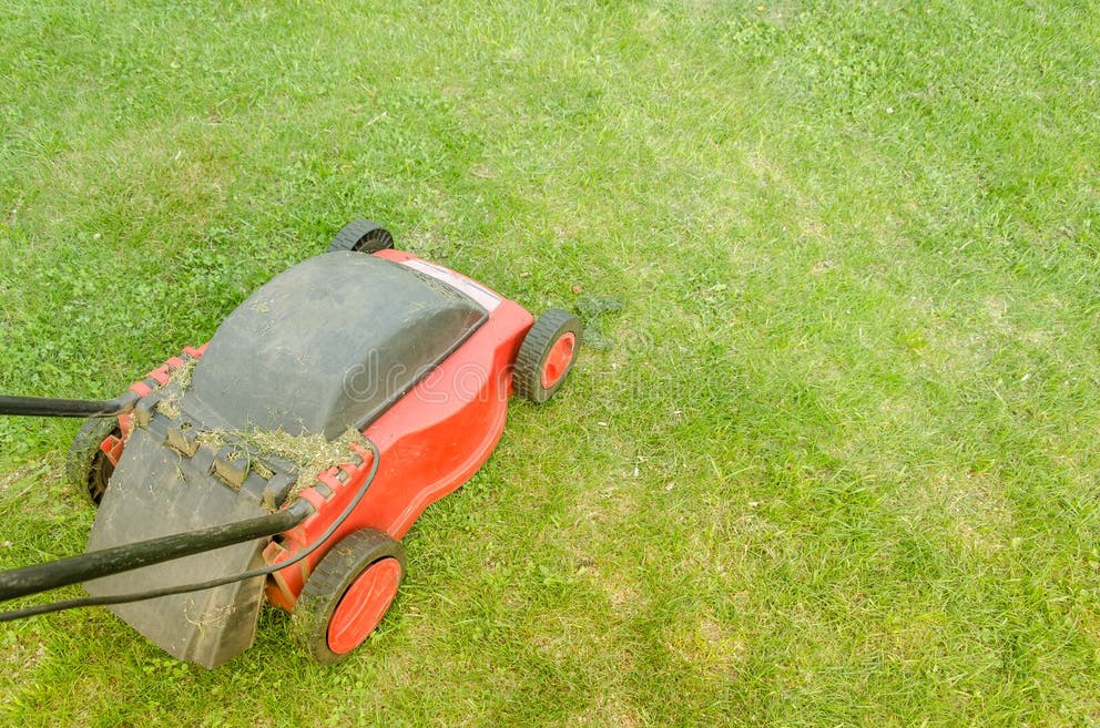 Red Lawn Mower on the Lawn/red Lawn Mower on the Lawn. Top View Stock ...