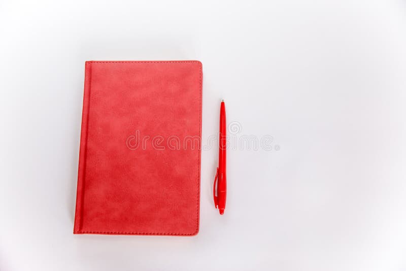 Red Leather daily Planner with a Pen Isolated on White Background Stock ...