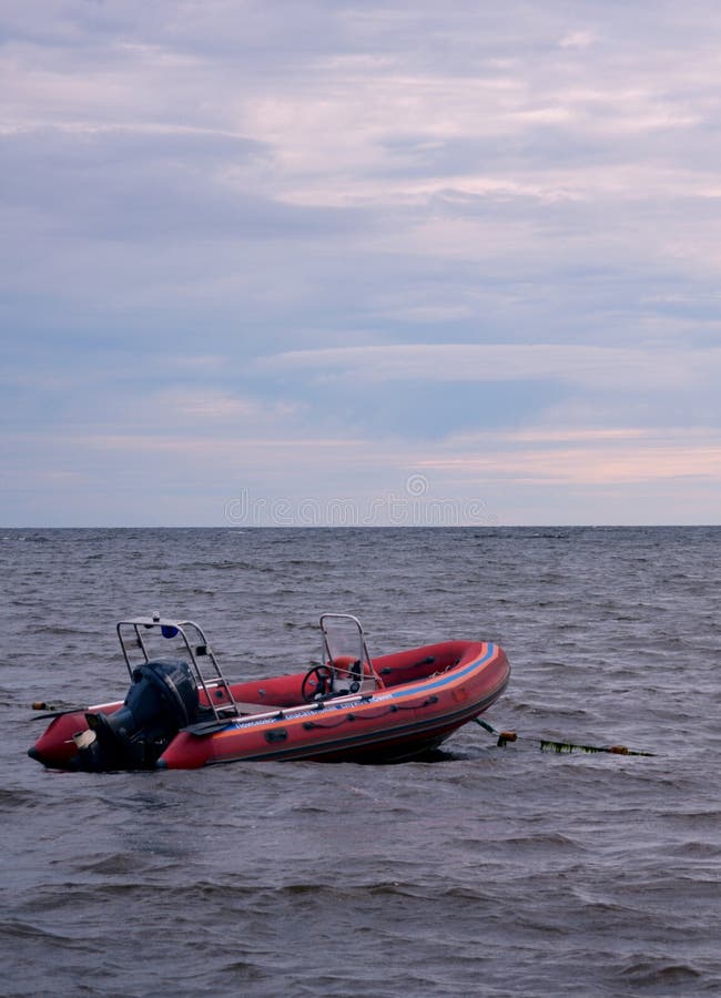 Red lifeboat in water Ð¾ editorial stock image. Image of sand - 98660529