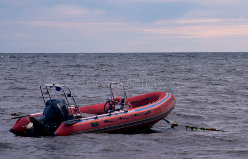 Red lifeboat in water. editorial image. Image of nautical - 98660565