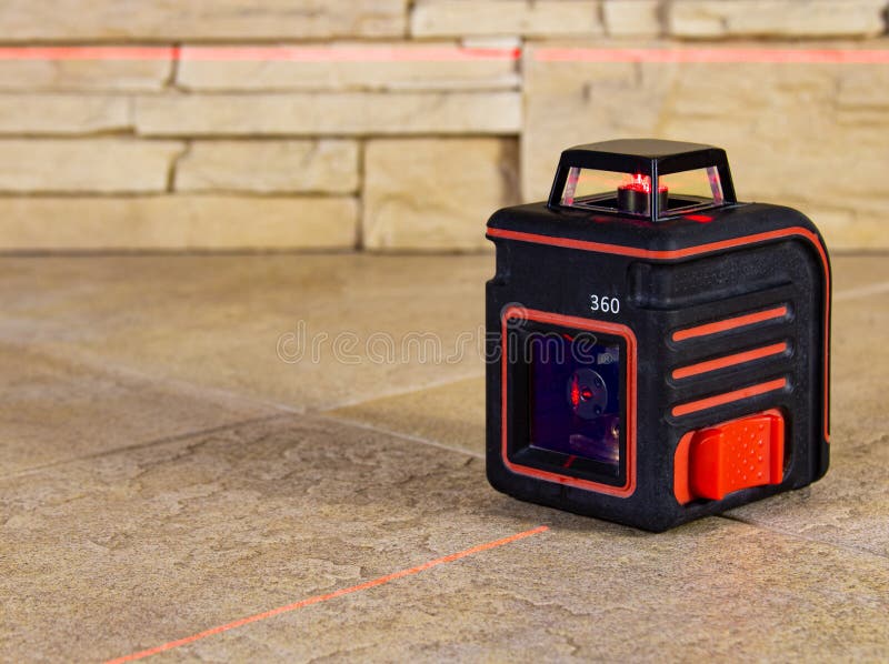 The Red Light Beams of the Laser Level Device on the Wall and Floor ...