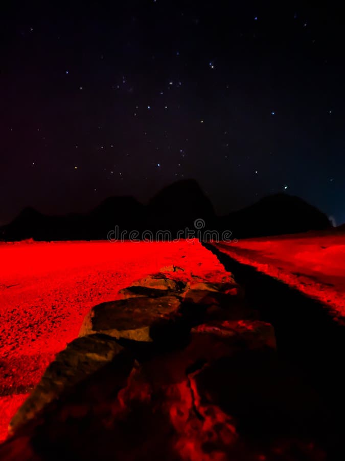 Red Light on an Empty Brick and Sandy Path in the Desert Under the ...