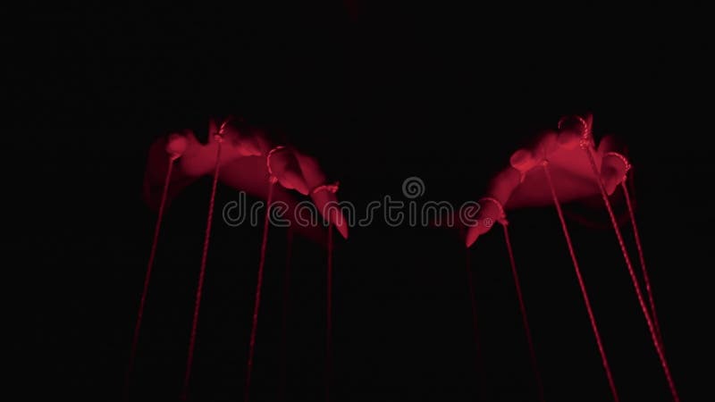 Red Light Hands with Strings in Dark Background Stock Footage - Video ...