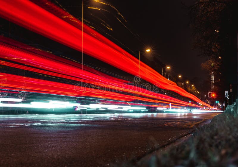 Red Light Trails in the Illuminated Highway at Night Stock Photo ...