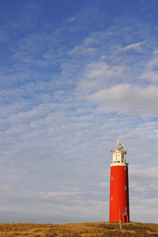 Red lighthouse stock image. Image of clouds, texel, landscape - 3500839