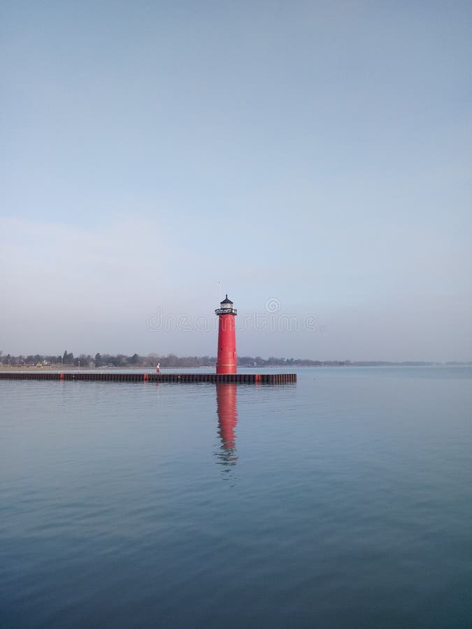 Red Lighthouse on Calm Water Stock Image - Image of electricity, calm ...