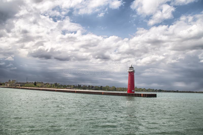 Red Lighthouse by the Edge of the Sea Stock Image - Image of edge, pier ...