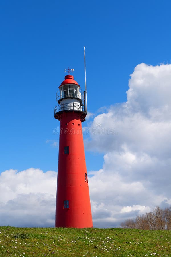 Red lighthouse in Holland stock image. Image of south - 330197841