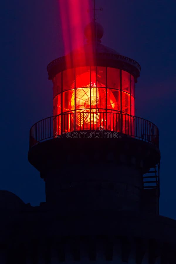 Red lighthouse illuminated stock image. Image of rays - 16094179