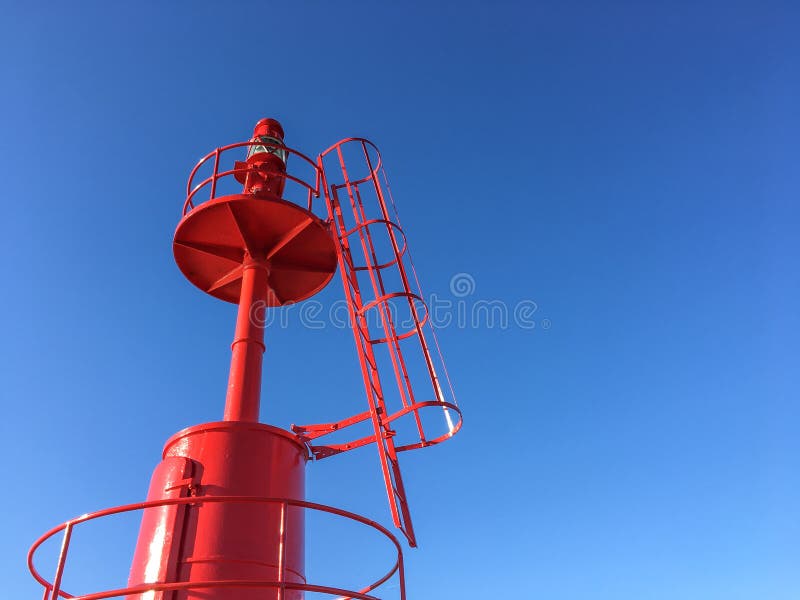 Red Lighthouse Inside at Port with Blue Sky Stock Photo - Image of ...