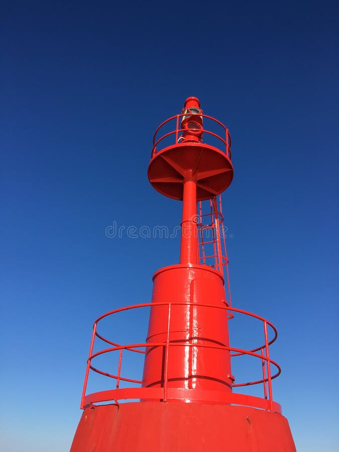 Red Lighthouse Inside at Port with Blue Sky Stock Image - Image of ...