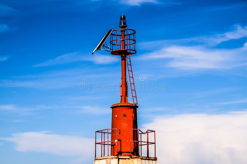 A Red Lighthouse with a Ladder on Top of it Stock Photo - Image of ...