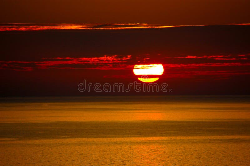 Red Lighthouse with Light Beam at Sunset. the Top Stock Image - Image ...