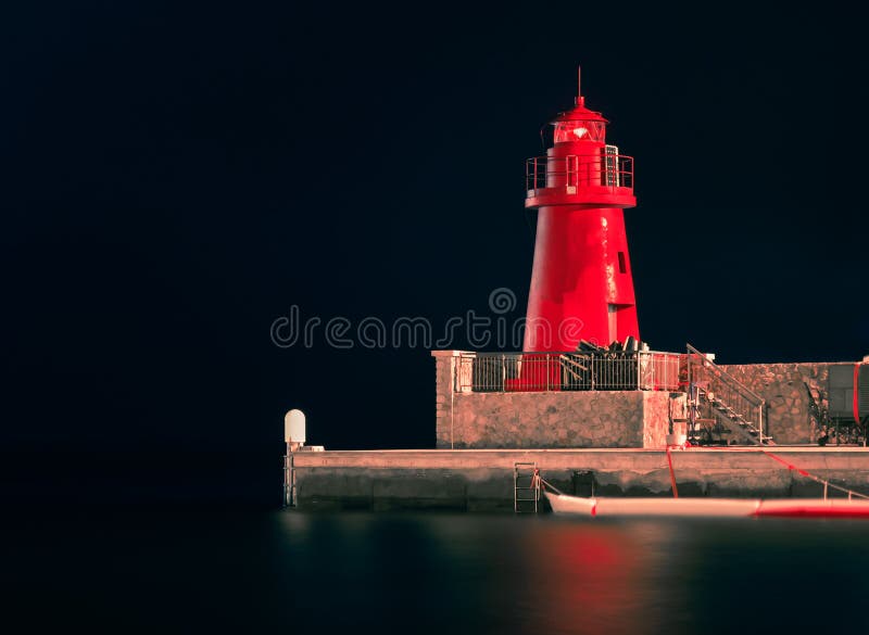 Red Lighthouse by Night stock photo. Image of night, isola - 34152960