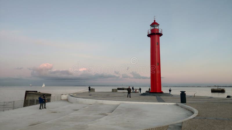 Red Lighthouse at Sunset on the Ocean. Stock Image - Image of beach ...