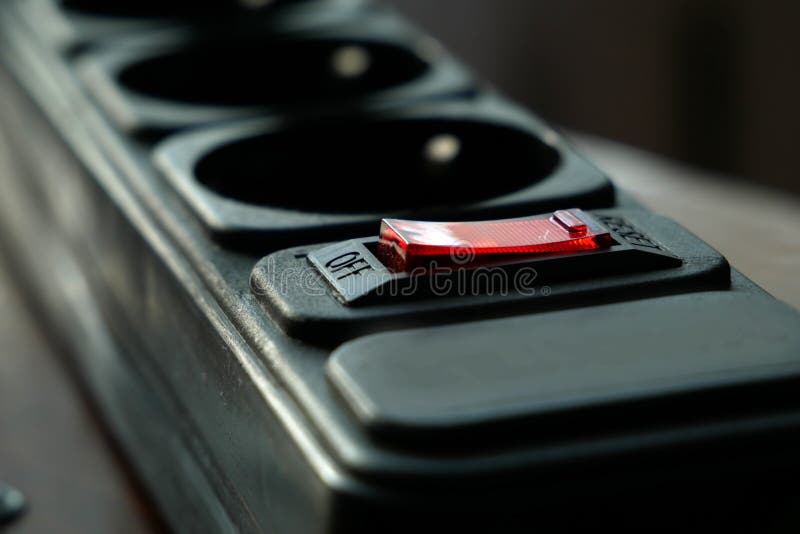 Red Lighting Outlet Switch on Black Electric Extension Cord Stock Photo ...