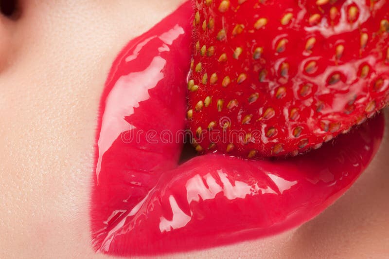 Lips with strawberry. stock photo. Image of lipstick - 44430084